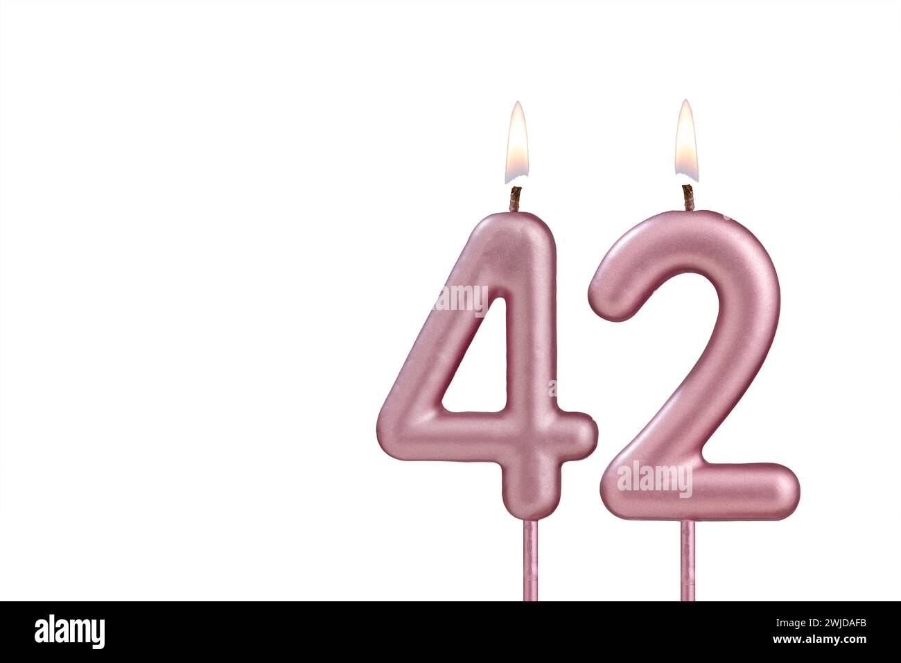 Lit birthday candle - Candle number 42 on white background Stock Photo ...