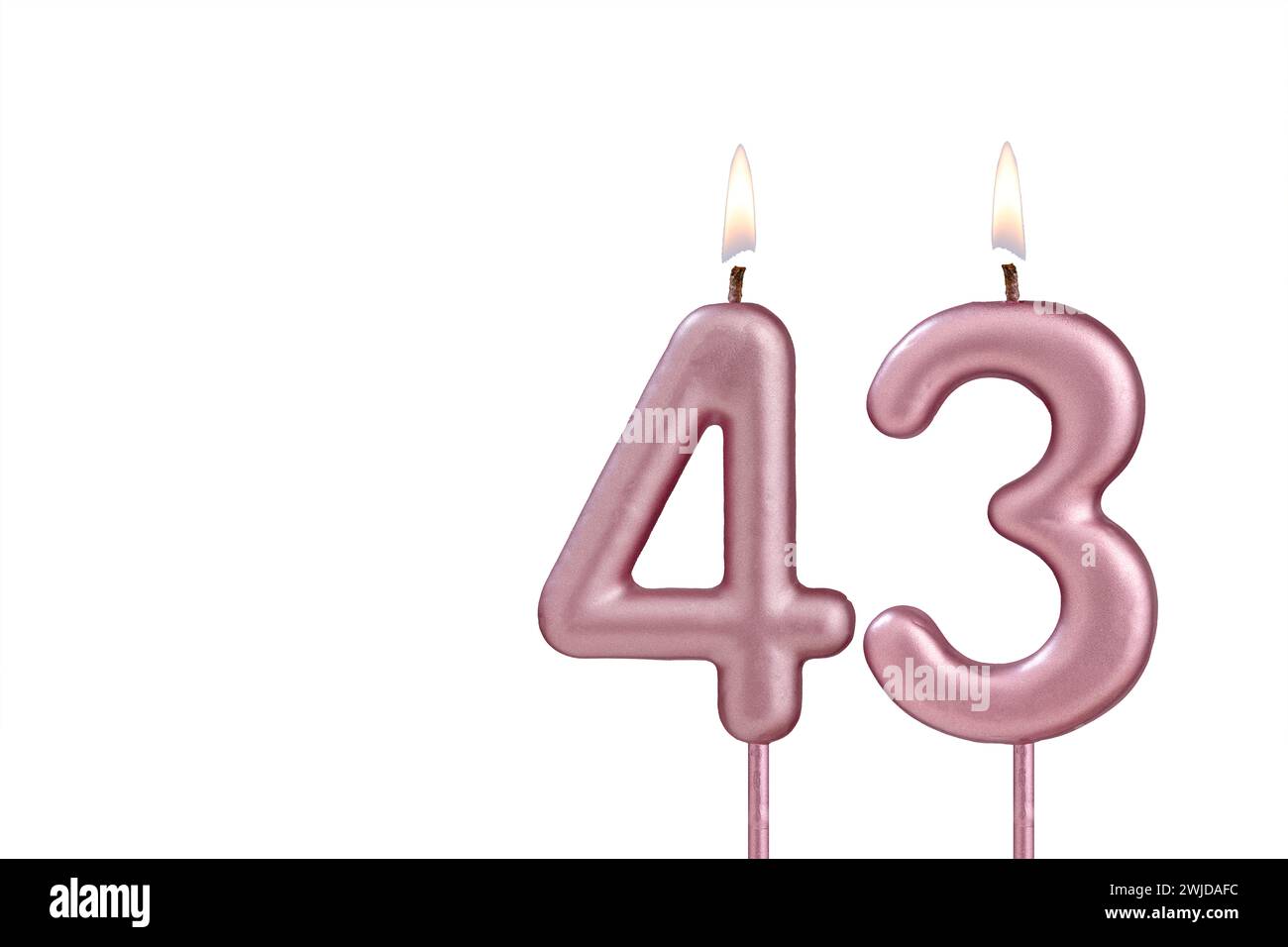 Candle number 43 - Lit birthday candle on white background Stock Photo ...