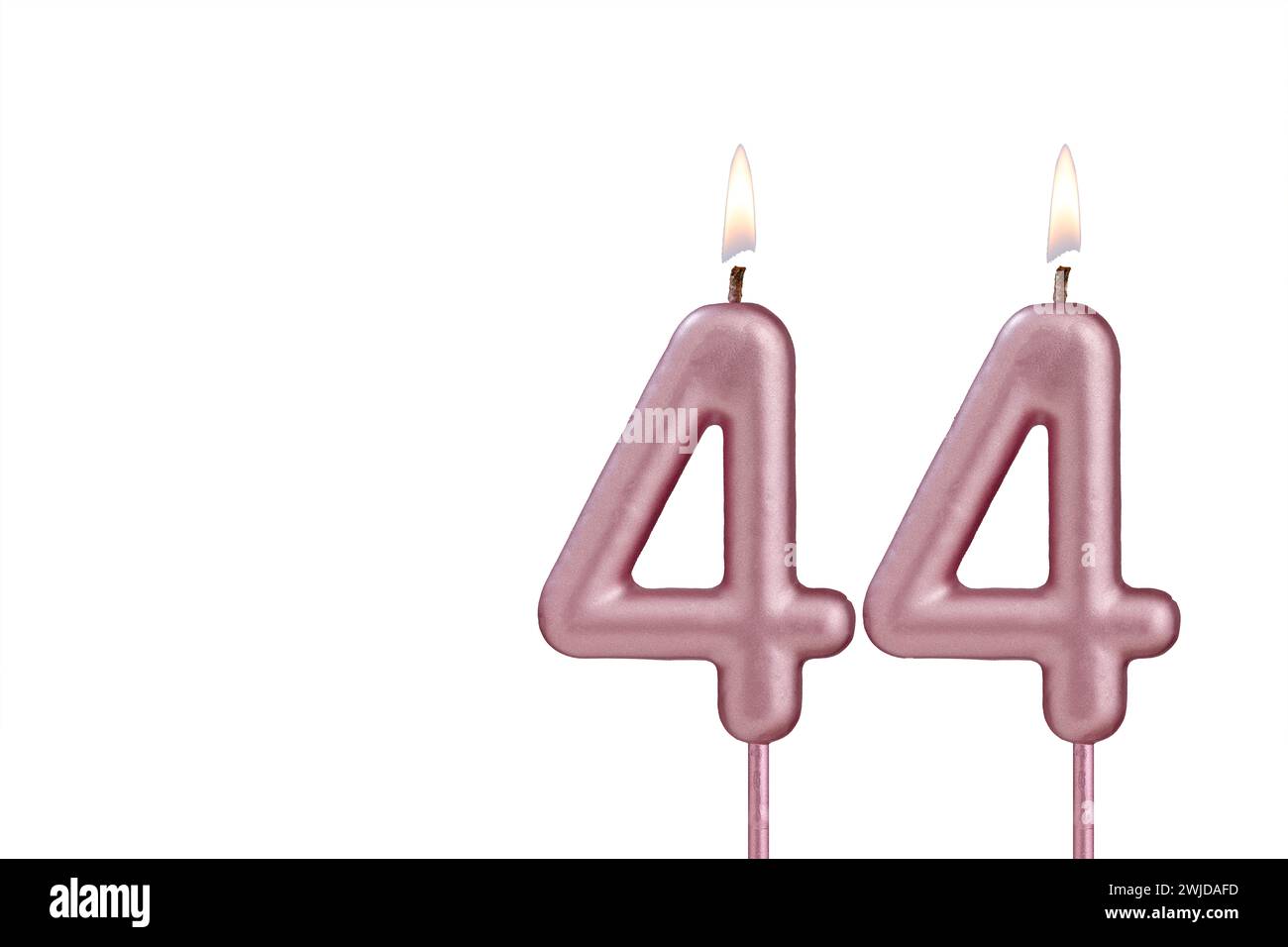 Lit birthday candle - Candle number 44 on white background Stock Photo ...