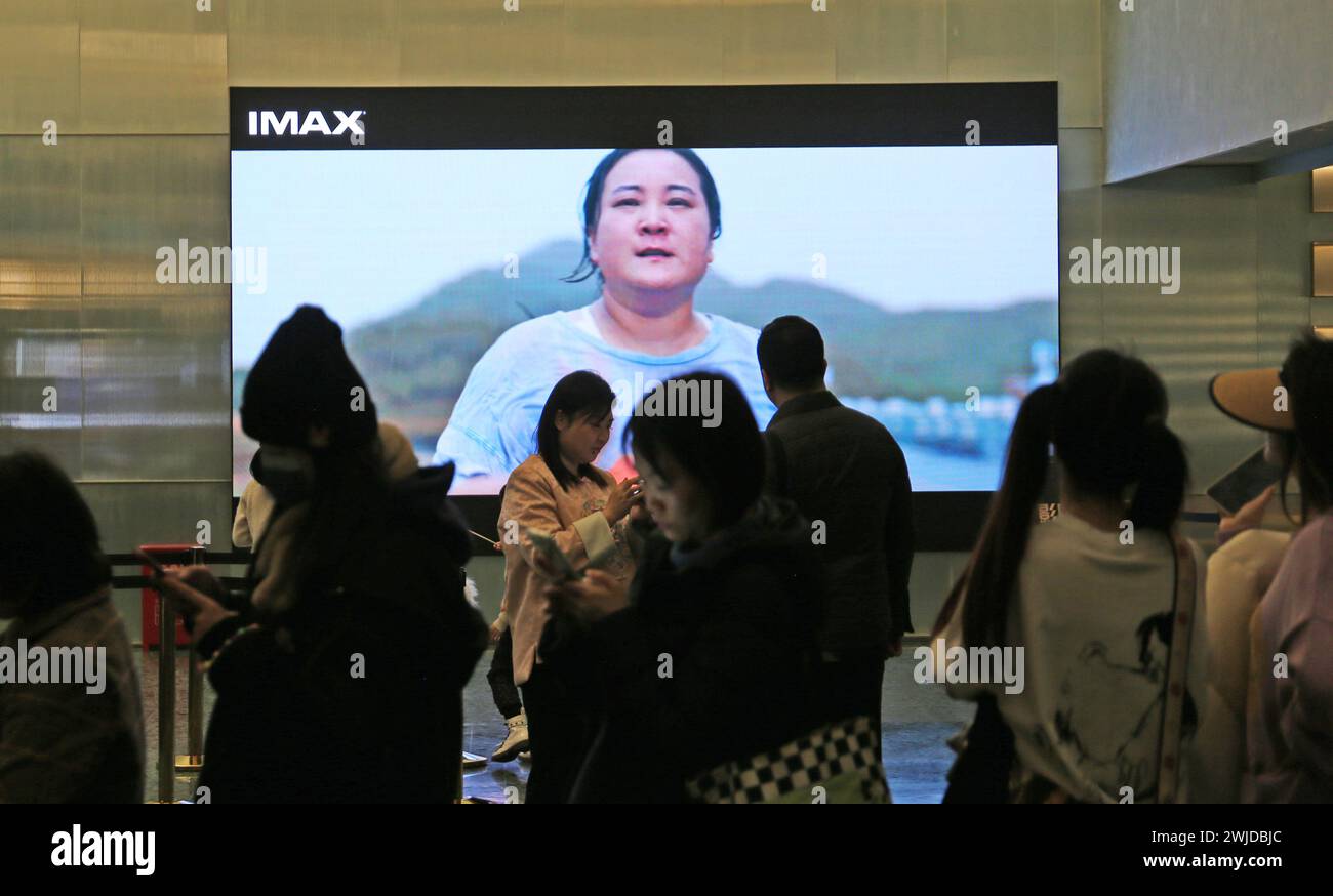 SHANGHAI, CHINA - FEBRUARY 14, 2024 - Fans pass the trailer of the ...