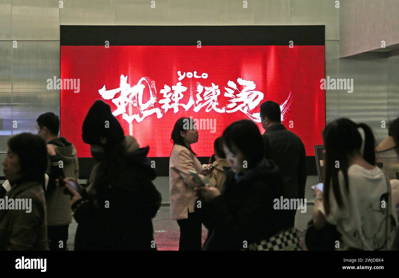 SHANGHAI, CHINA - FEBRUARY 14, 2024 - Fans pass the trailer of the ...