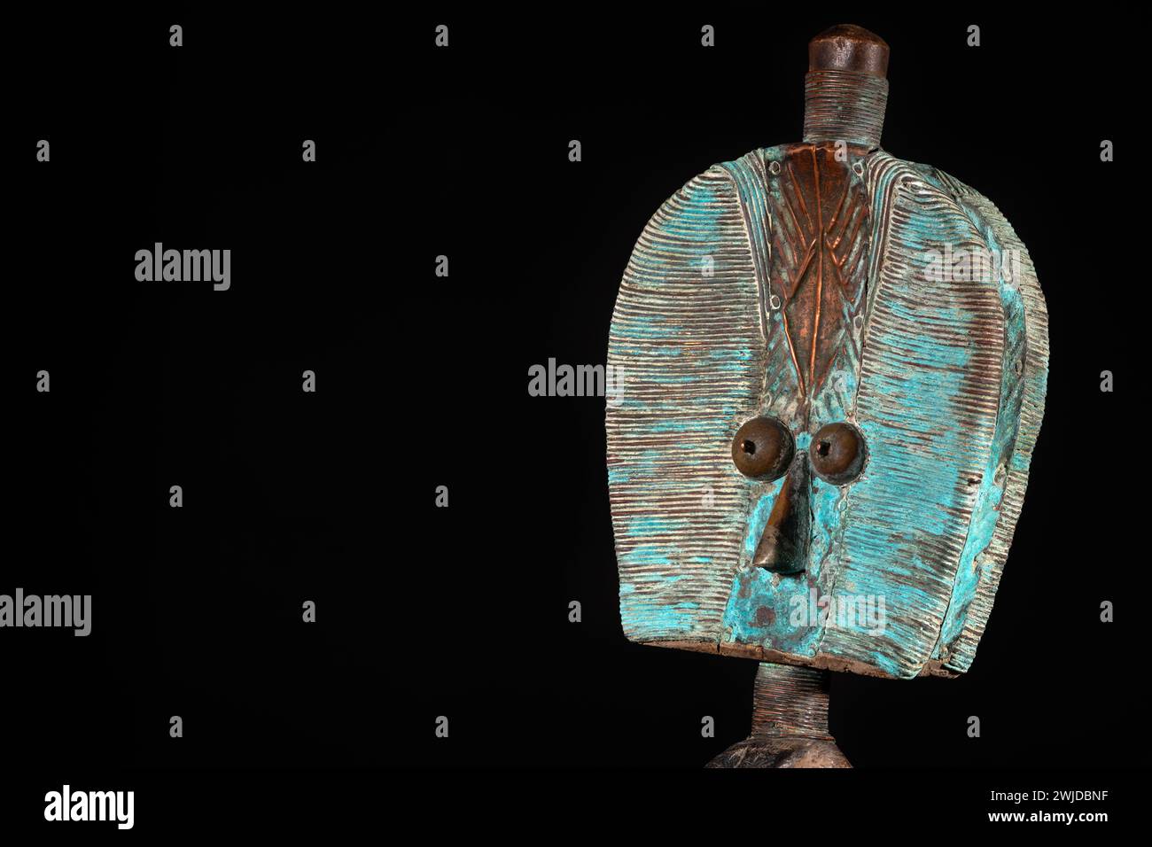 Close up of a wooden Kota reliquary figure from Gabon, isolated on a ...