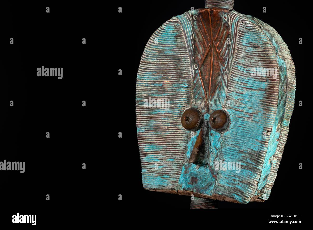 Close up of a wooden Kota reliquary figure from Gabon, isolated on a ...