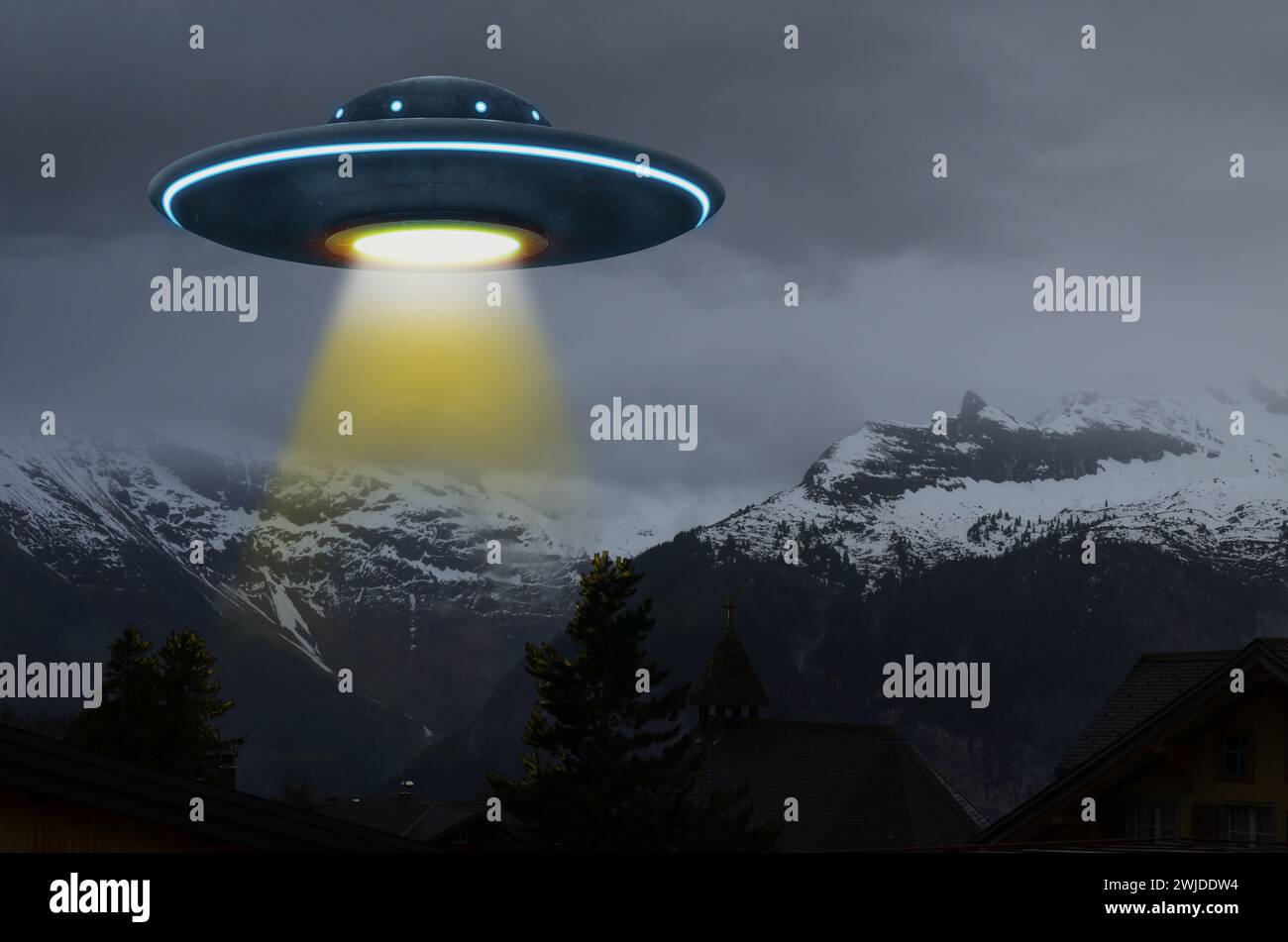 Alien spaceship emitting light beam in air over mountains. UFO Stock ...