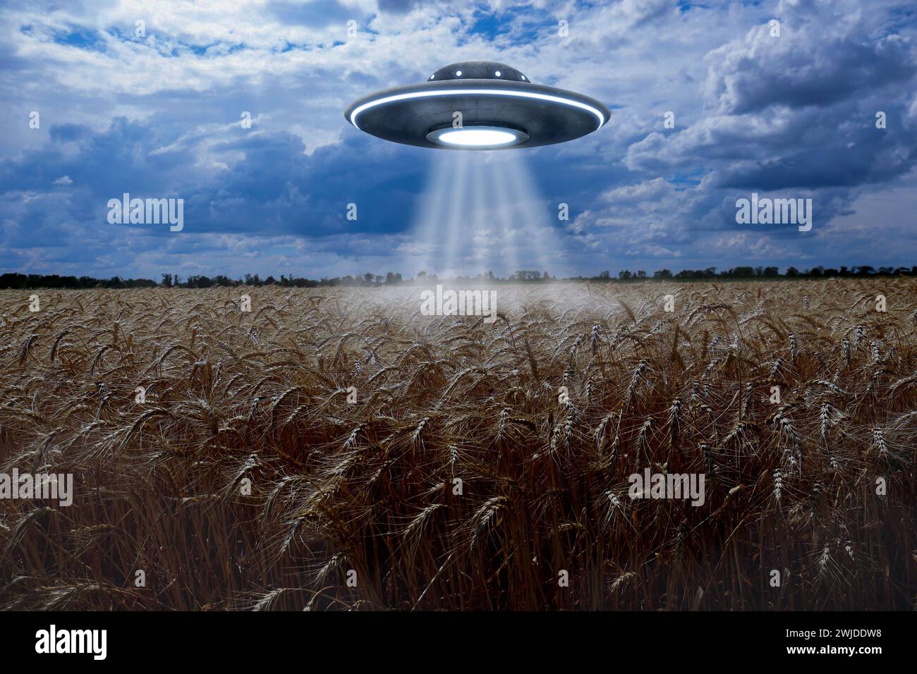 Alien spaceship emitting light in air over wheat field. UFO Stock Photo ...