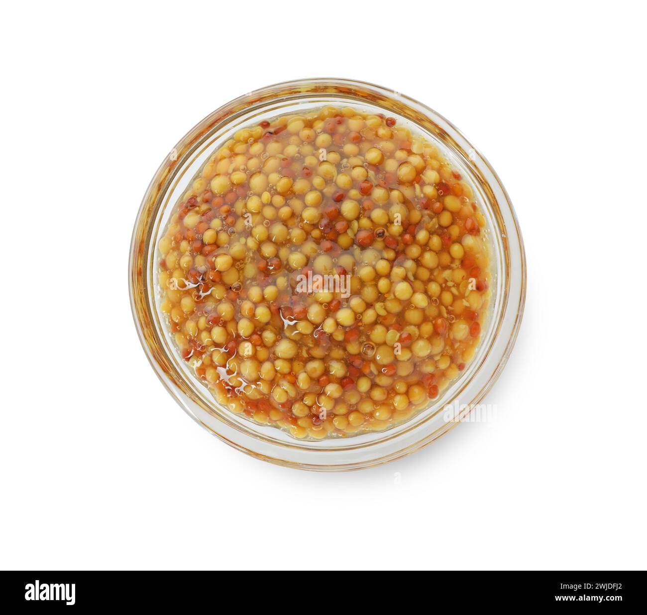 Fresh whole grain mustard in bowl isolated on white, top view Stock ...