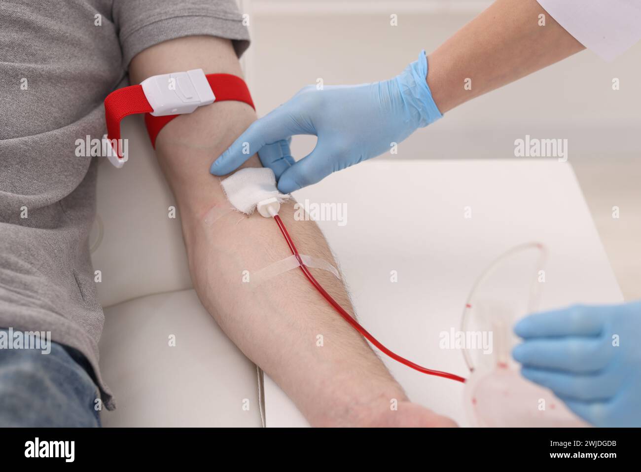 Patient undergoing blood transfusion in hospital, closeup Stock Photo ...