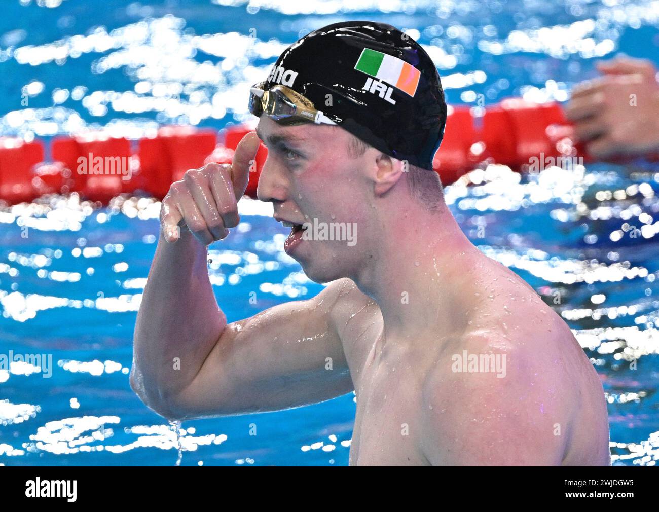 Doha, Qatar. 14th Feb, 2024. Daniel Wiffen of Ireland celebrates after ...