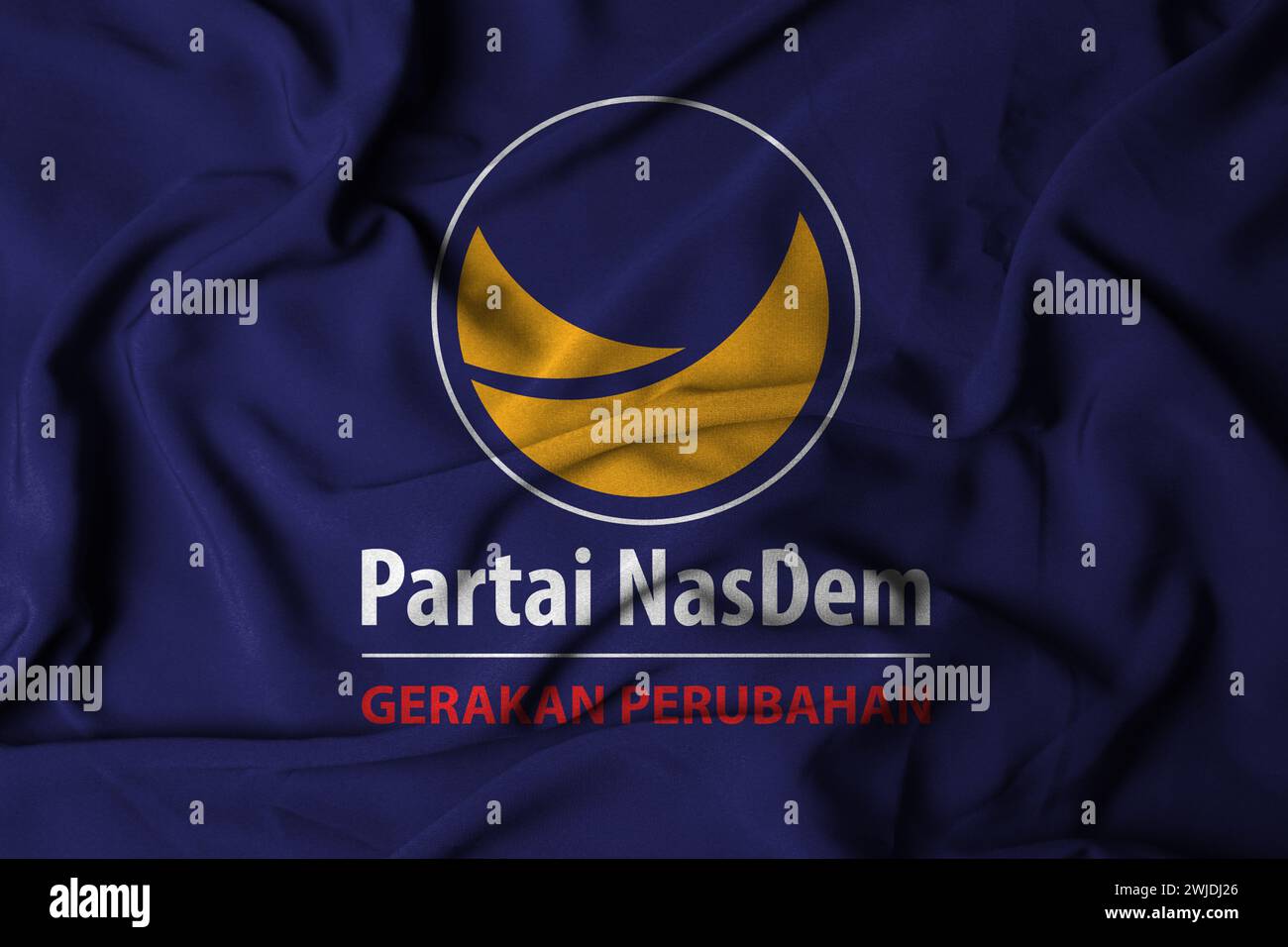 Selective focus of NASDEM Party flag, with waving fabric texture. The ...
