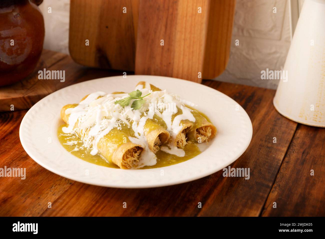Green enchiladas. Typical Mexican dish made with a folded or rolled ...