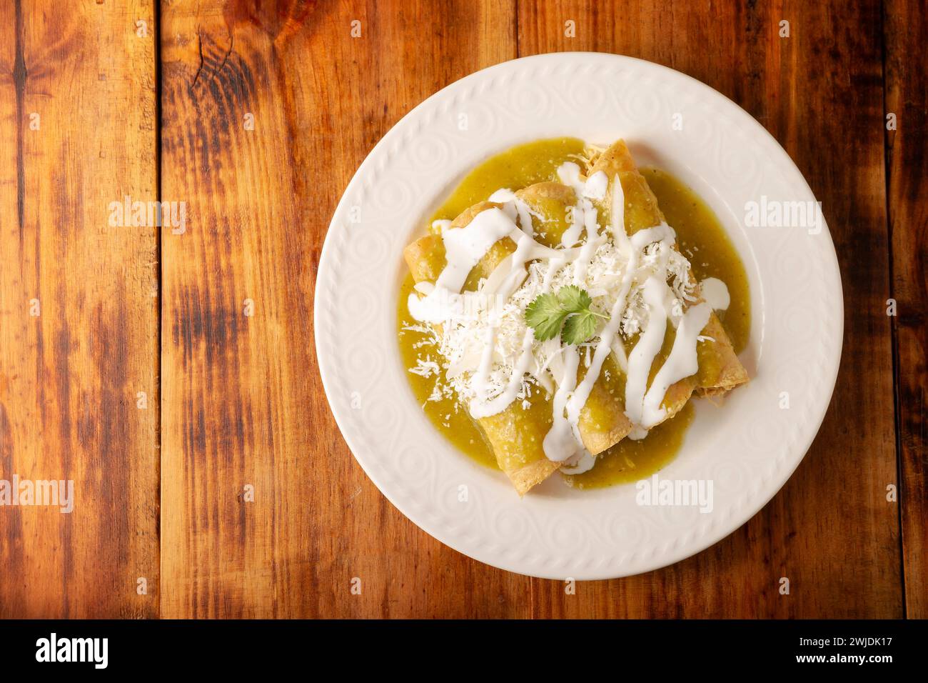 Green enchiladas. Typical Mexican dish made with a folded or rolled ...