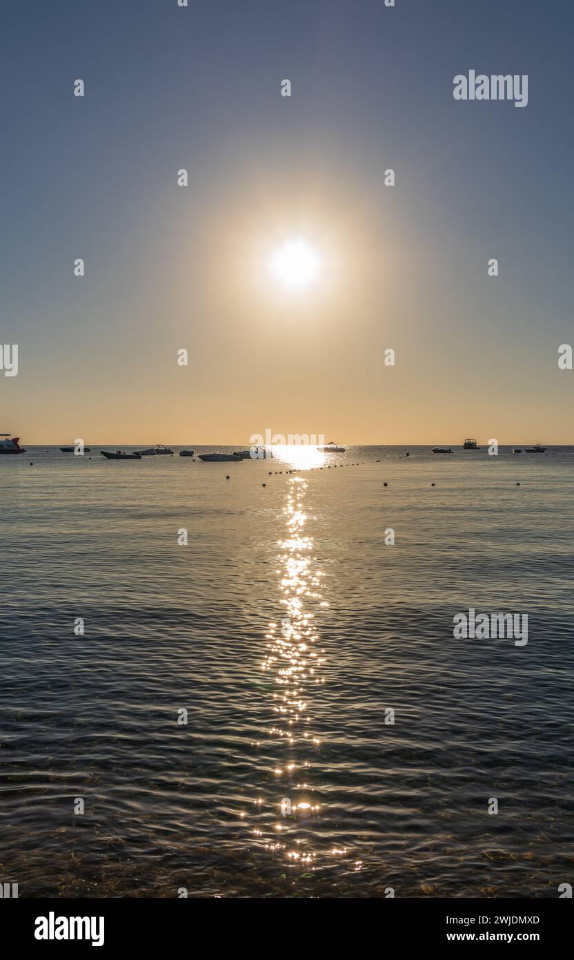 Sunrise over the sea. Panoramic seascape. Burning sky and shining ...