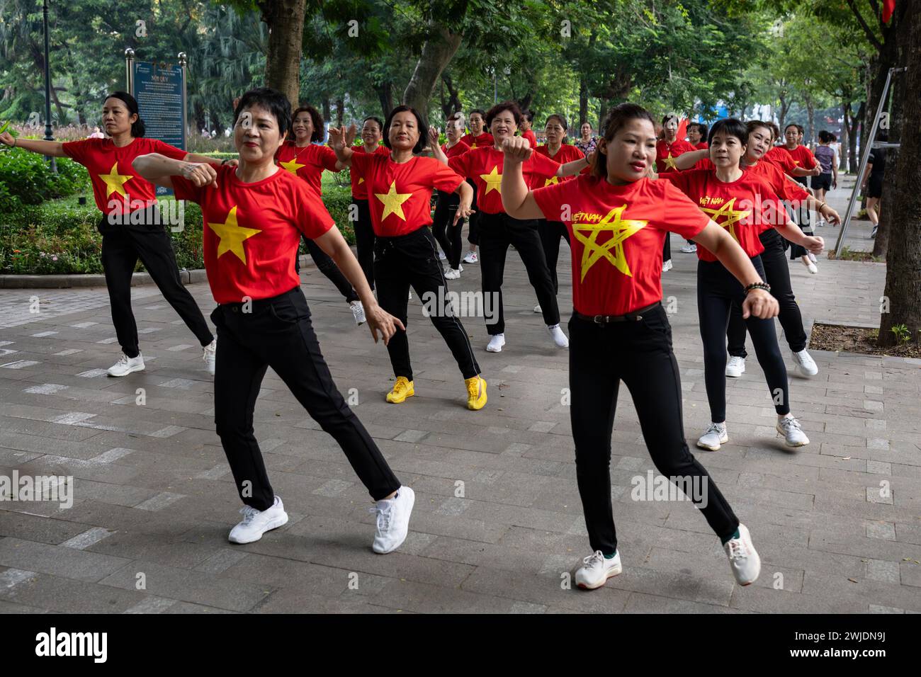 Women doing early morning exercises around Hoan Kiem Lake in Hanoi ...