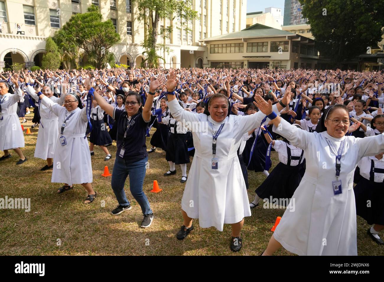 Catholic nuns and students at St. Scholastica's College perform during ...