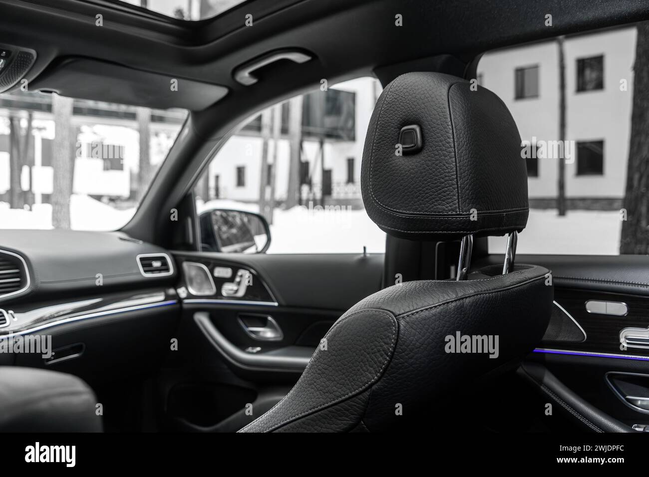 The front seat for passengers is covered in black leather. Comfortable ...