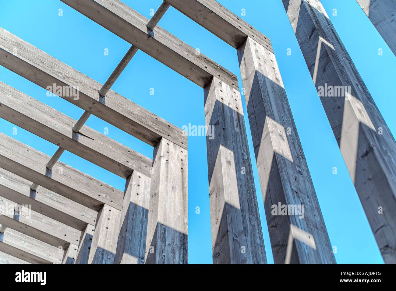 Modern Wooden Beam Structure with Geometric Patterns and Shadows Under ...