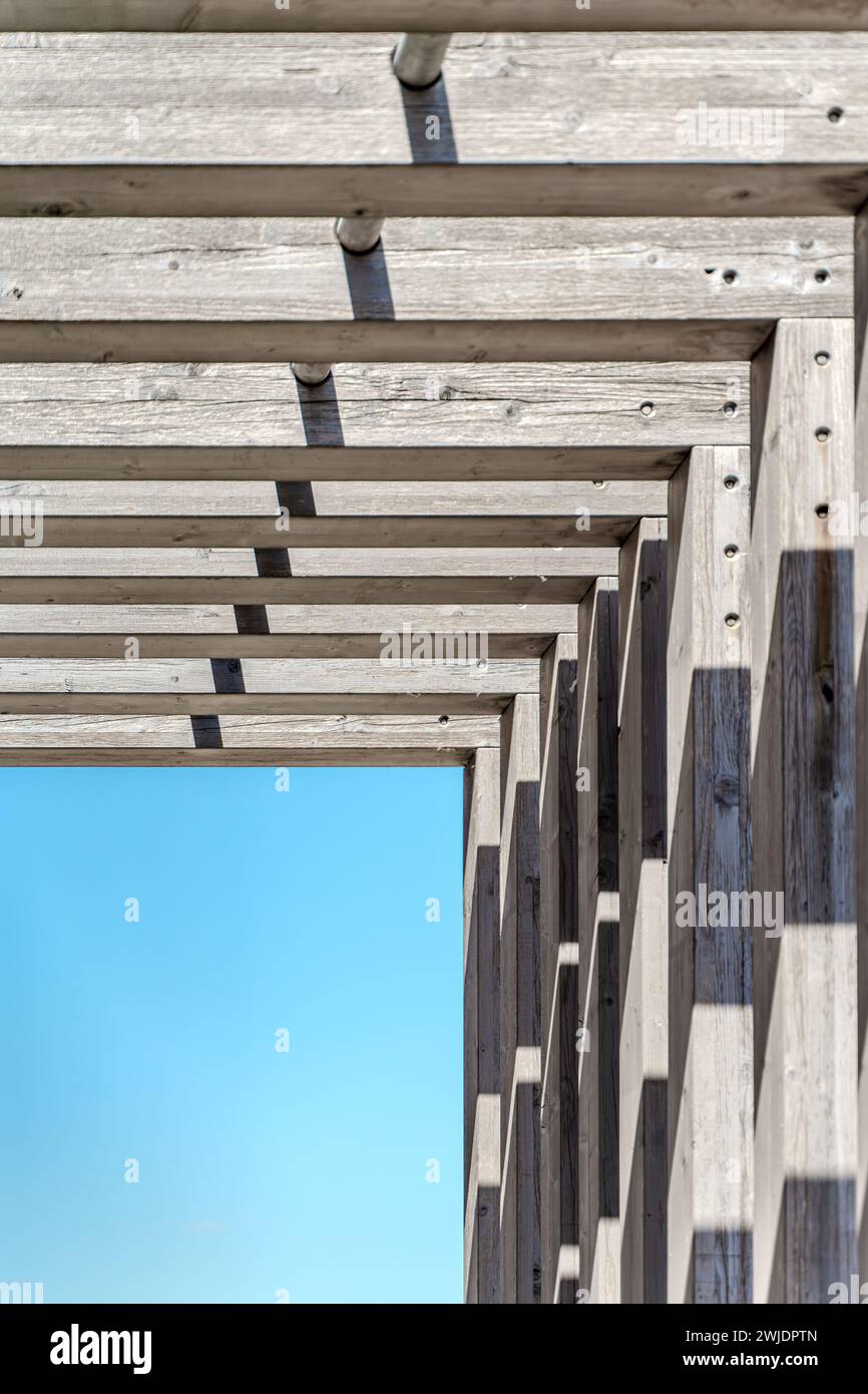 Modern Wooden Beam Structure with Geometric Patterns and Shadows Under ...