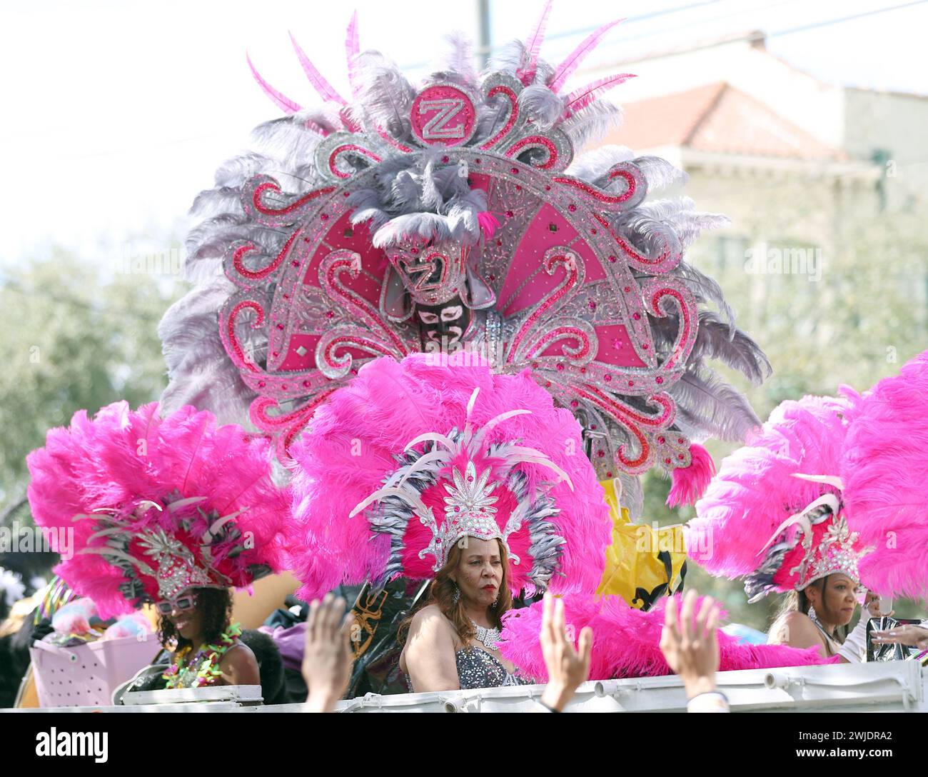 New Orleans, USA. 13th Feb, 2024. Float riders get ready to throw some ...