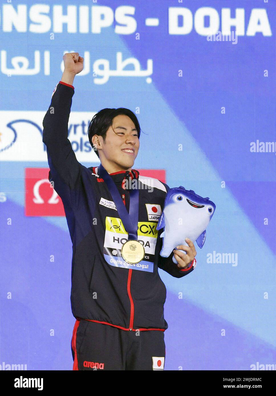 Tomoru Honda of Japan reacts after receiving the men's 200-meter ...