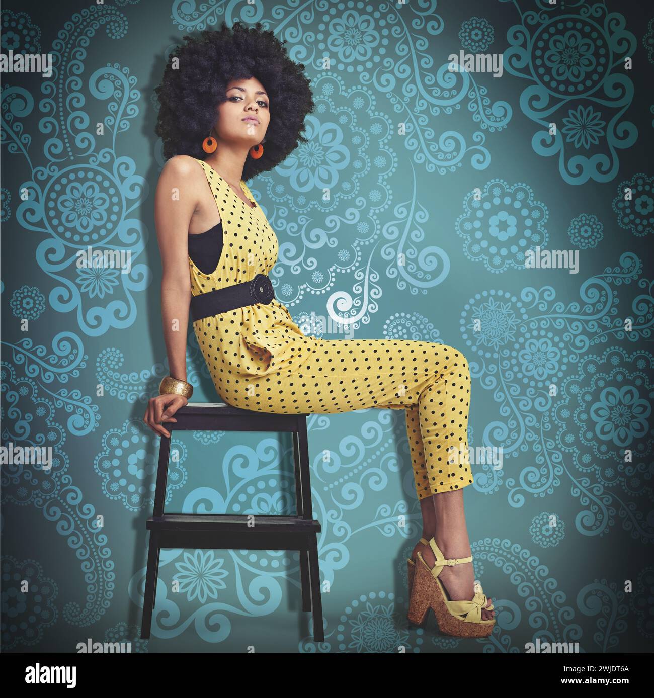 Portrait, young woman and fashion in 70s retro colour jumpsuit and ...