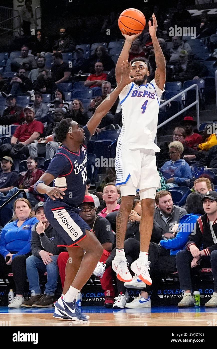 DePaul guard K.T. Raimey, right, shoots against UConn guard Hassan ...