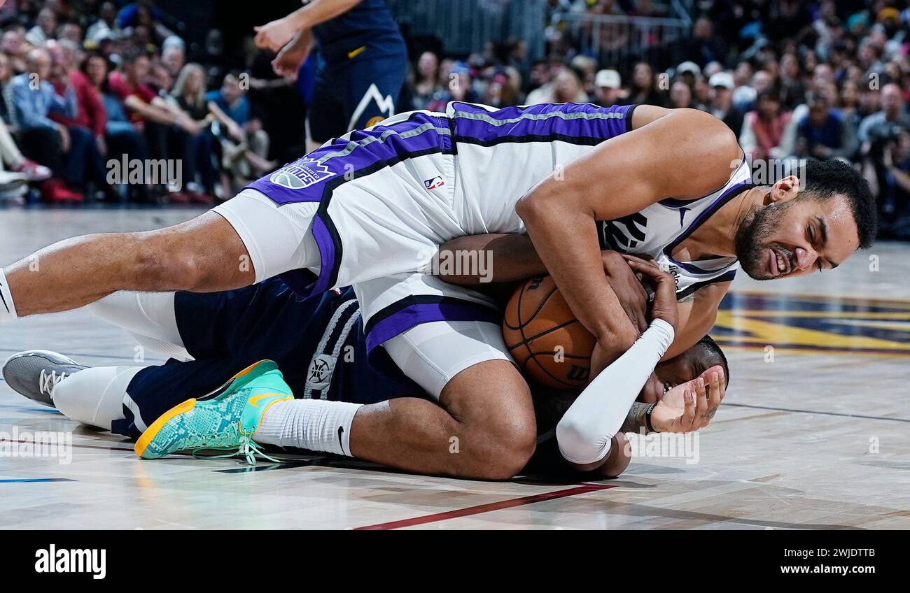 Sacramento Kings forward Trey Lyles, top, fights for control of a loose ...
