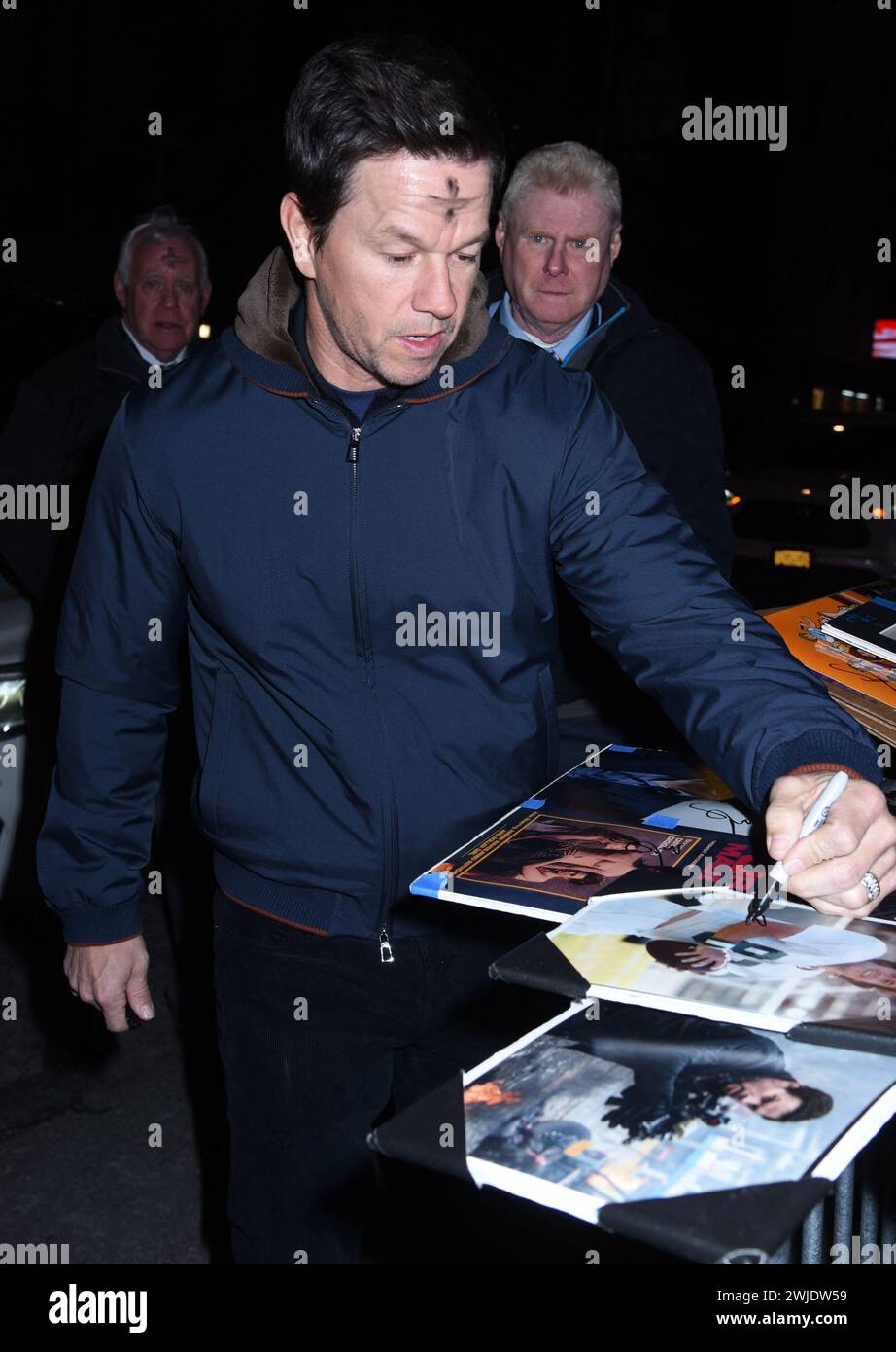New York City, United States. 14th Feb, 2024. Mark Wahlberg bears his ...