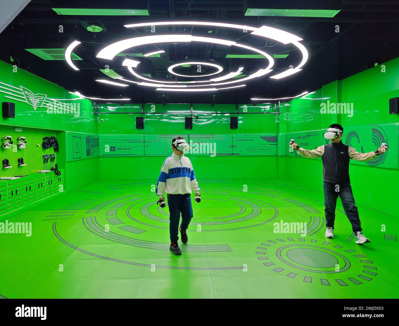 Children play a VR game in a game room in Hengshui city in north China ...