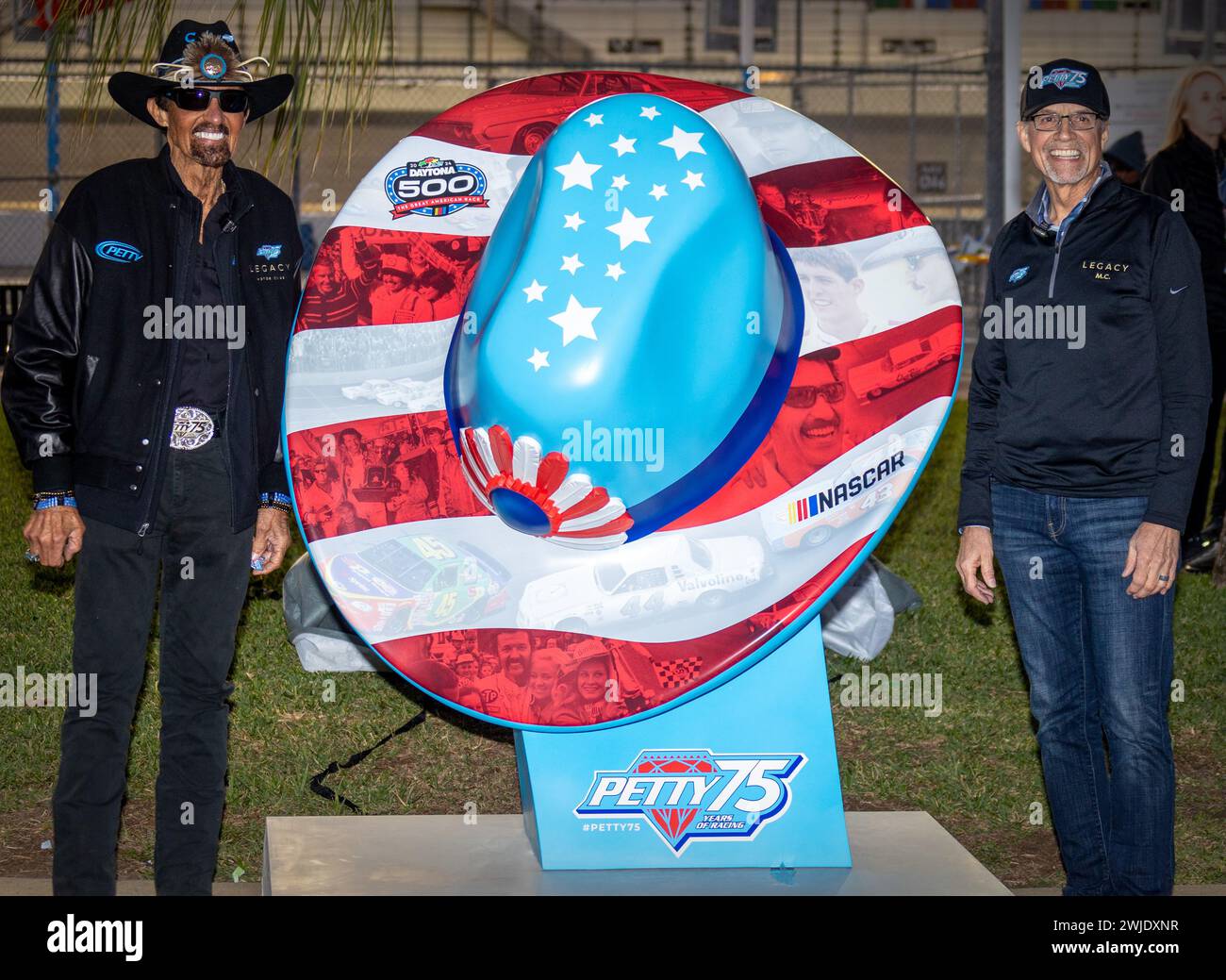 Richard Petty (L) and Kyle Petty are honored for the family's 75 years ...