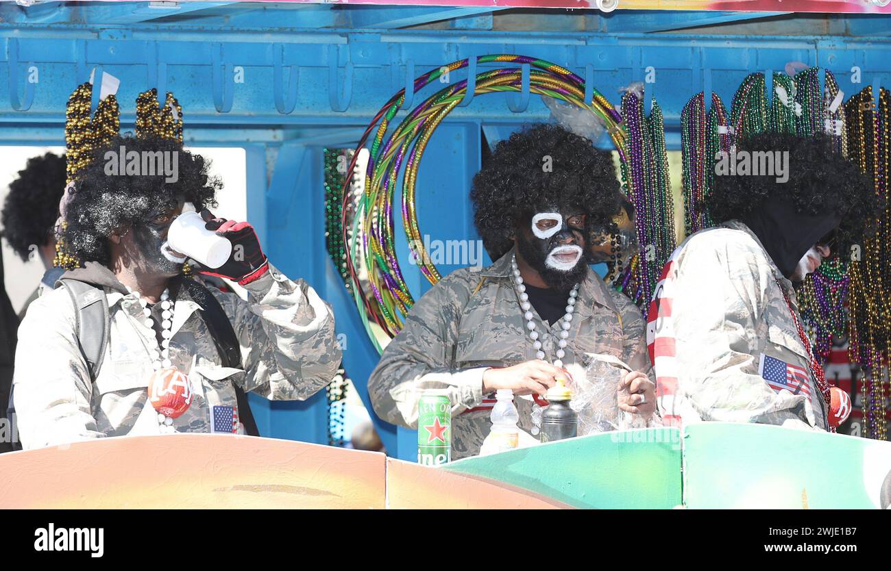 New Orleans, USA. 13th Feb, 2024. Members of the Zulu float get ready ...