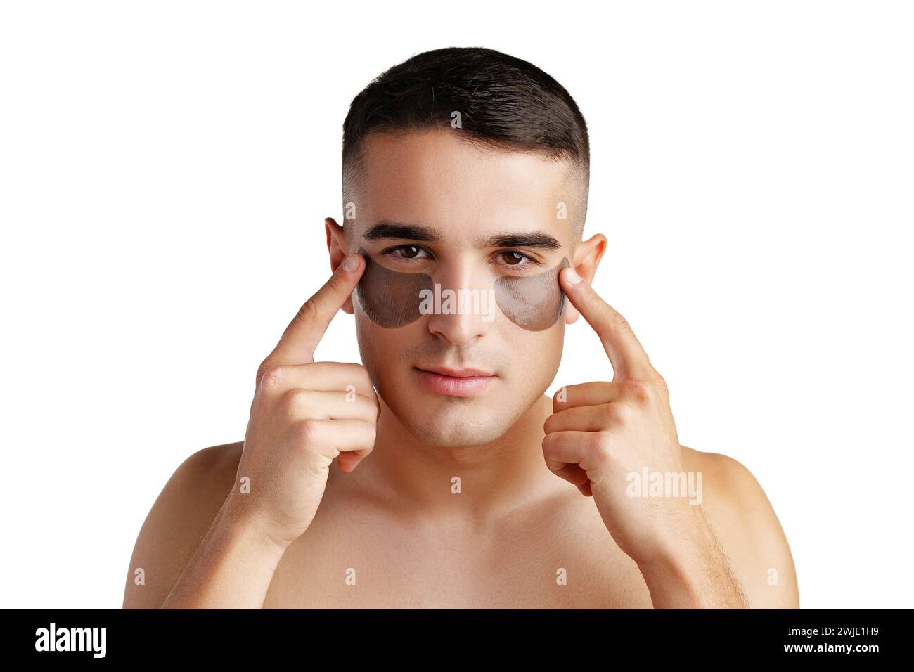 Portrait of attractive young male model with eye patches on white ...