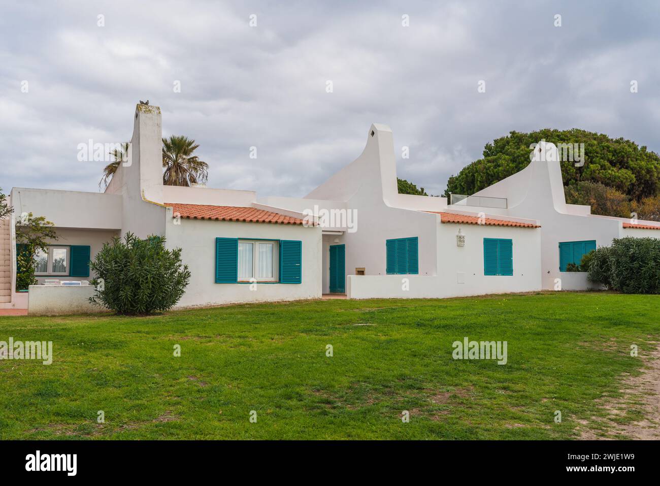 Charming cottages surrounded by lush greenery in a serene tourist ...