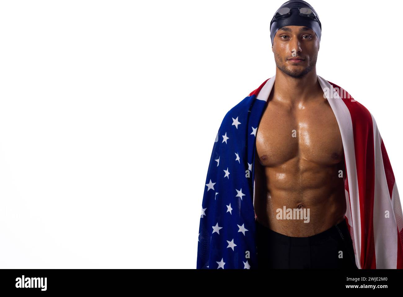 A biracial male swimmer wrapped in an American flag stands confidently ...