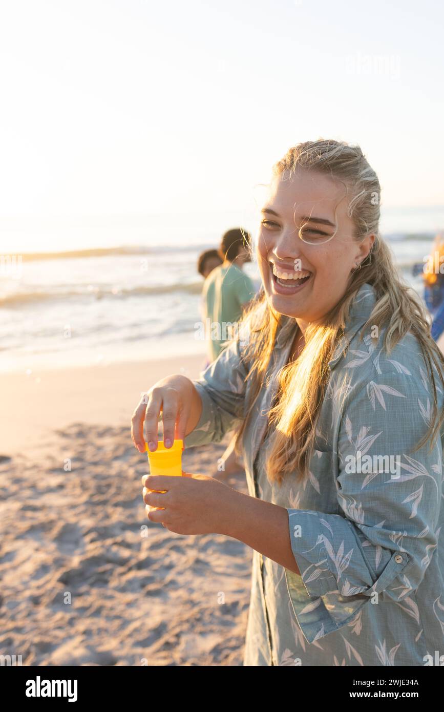 Happy woman enjoys sea waves hi-res stock photography and images - Alamy