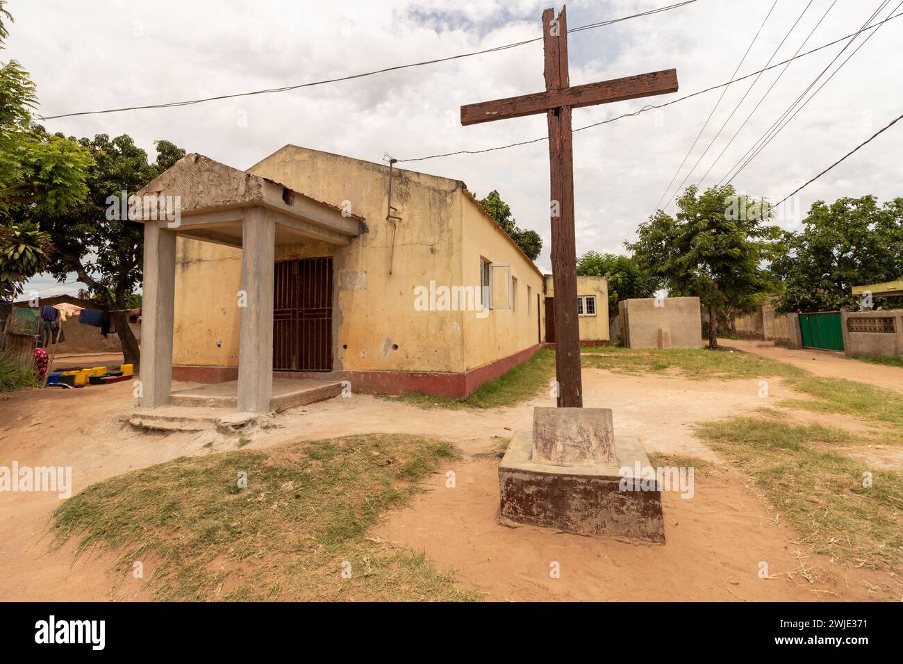 Small christian church building in Africa, adorned with a wooden cross ...