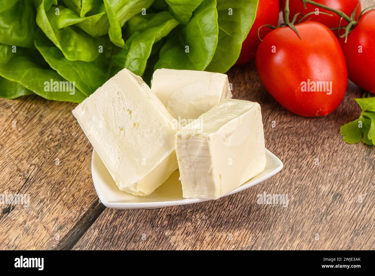Greek traditional Feta soft cheese in the plate Stock Photo - Alamy