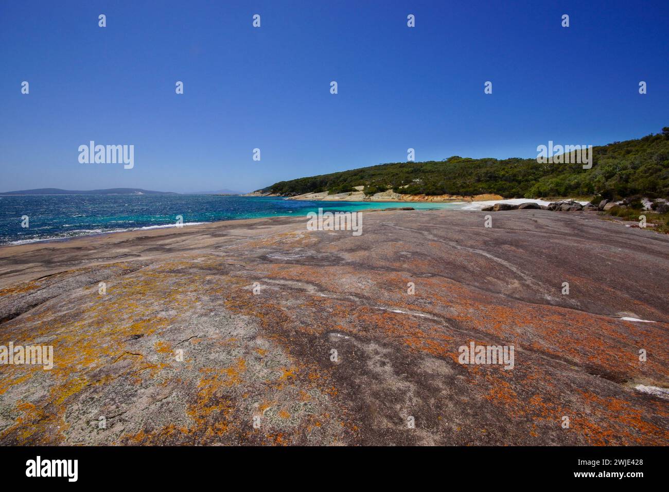 Colorful bald granite rock forming the coastline on Vancouver Peninsula ...