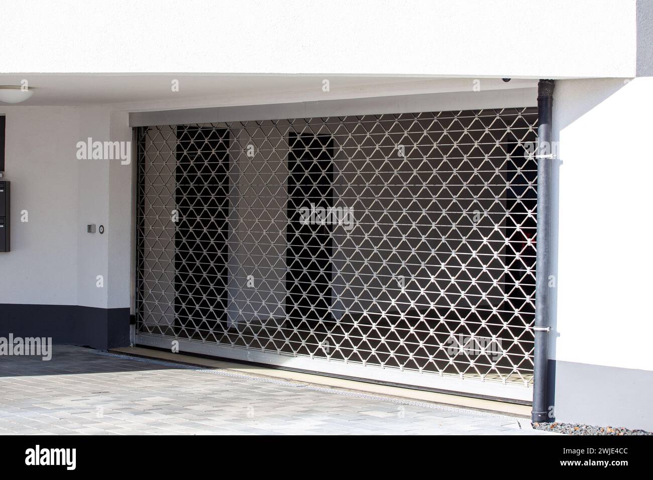 Roller shutter door at the entrance to the underground car park of a ...