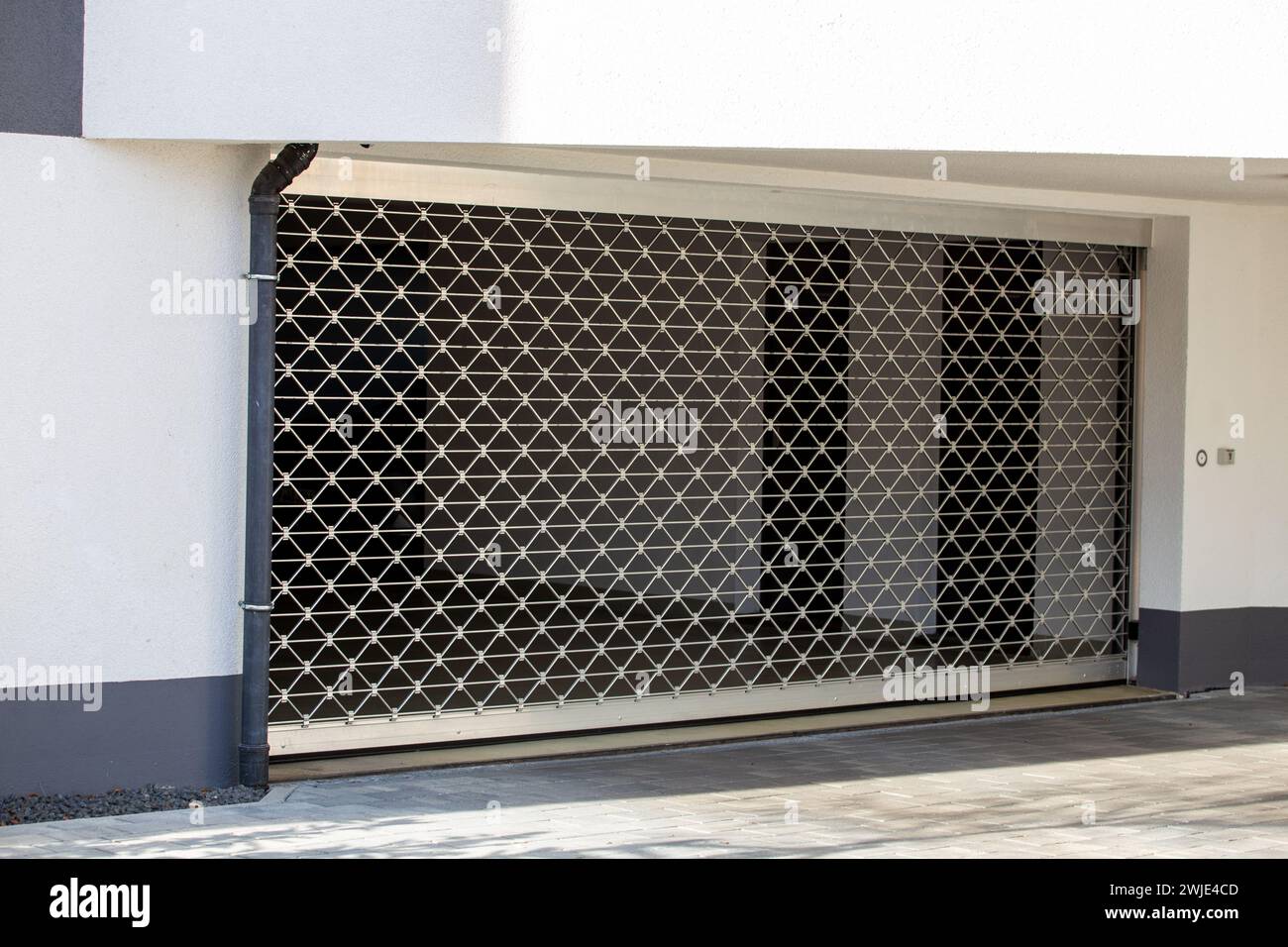 Roller shutter door at the entrance to the underground car park of a ...