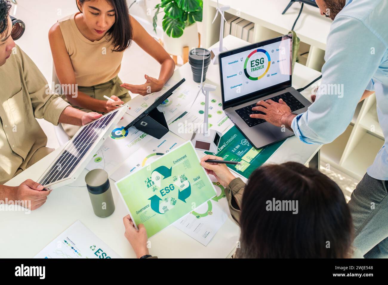 diversity team brainstorming focused on ESG (environment,social,governance) for sdgs goals in a ...