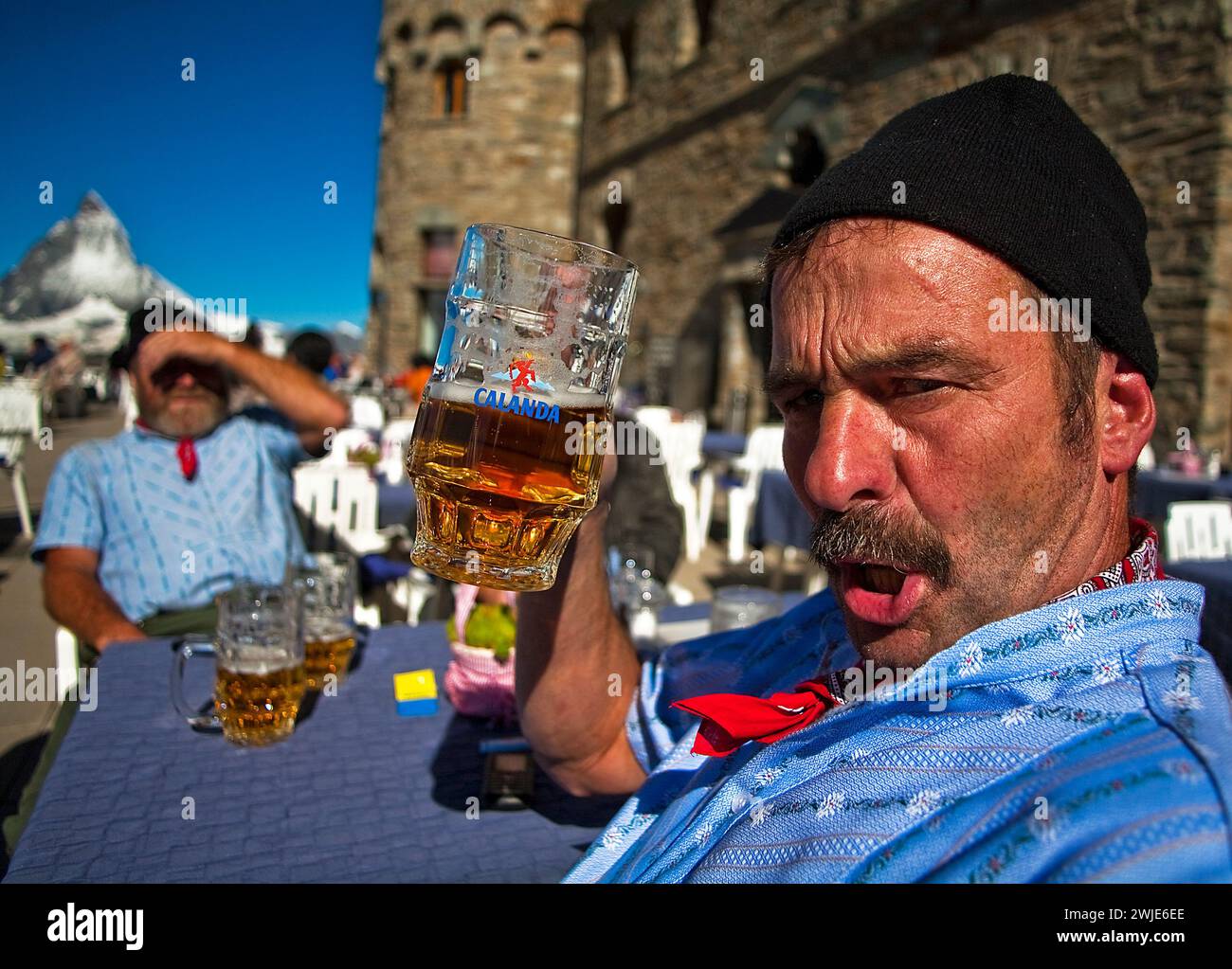 Tourists drinking beer at the Gornergrat Matterhorn observatory ...
