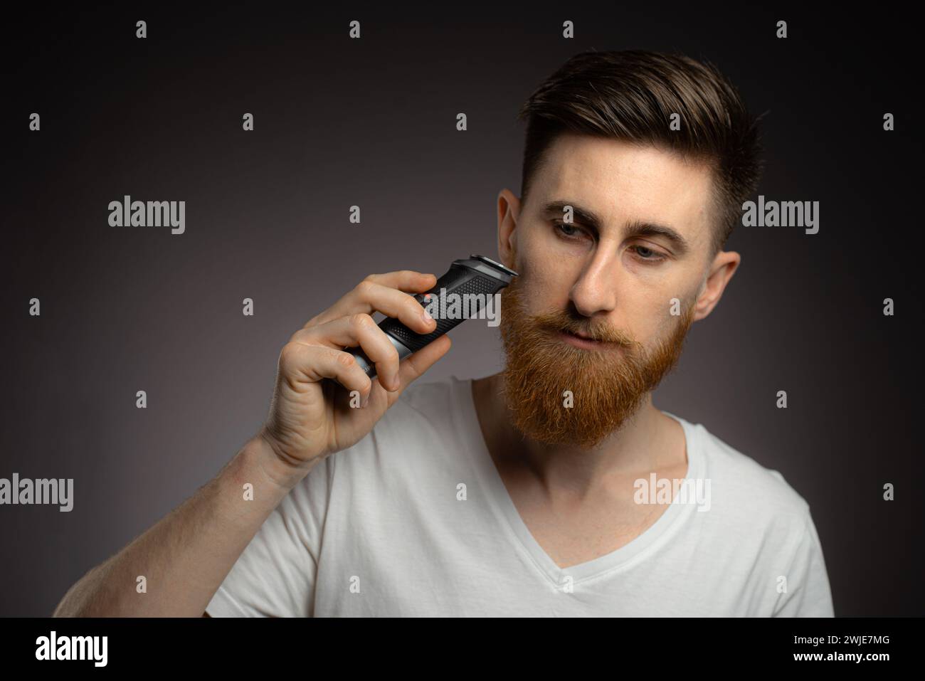 Man cuts beard trimmer hi-res stock photography and images - Alamy