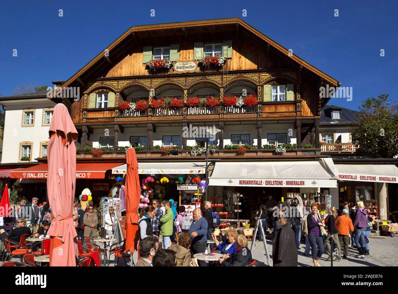 People gather in front of Hotel Schiffmeister, staging area for ...