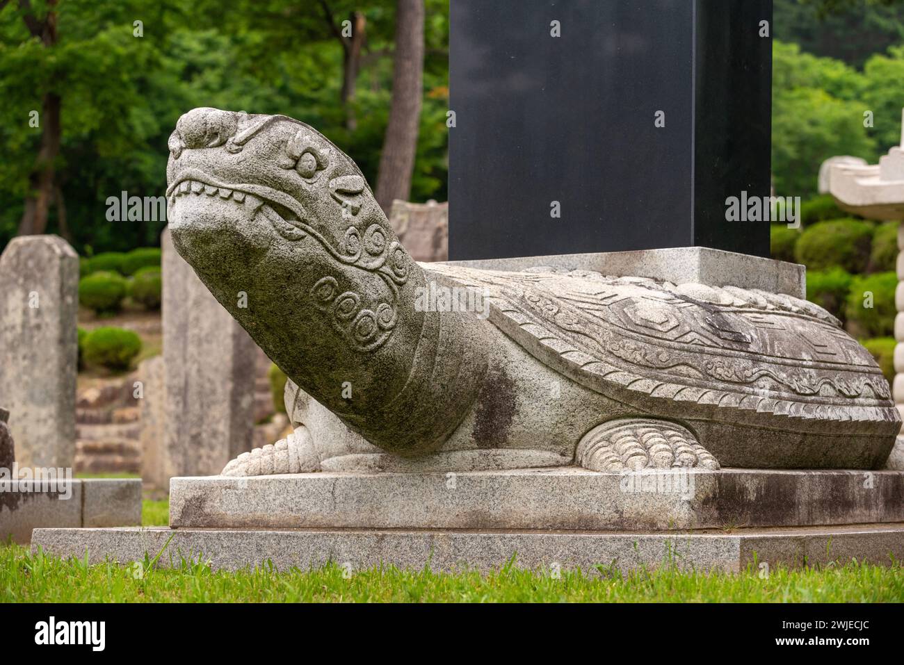 Close up of stone turtle with memorial stone on the yard of a Temple ...