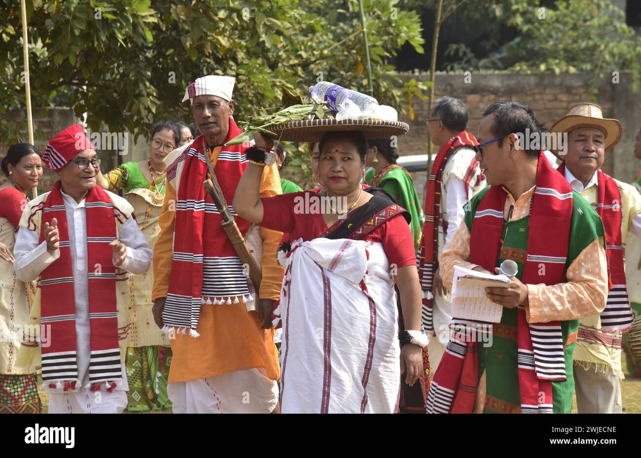 Guwahati, Guwahati, India. 14th Feb, 2024. Mising tribe woman carry ...