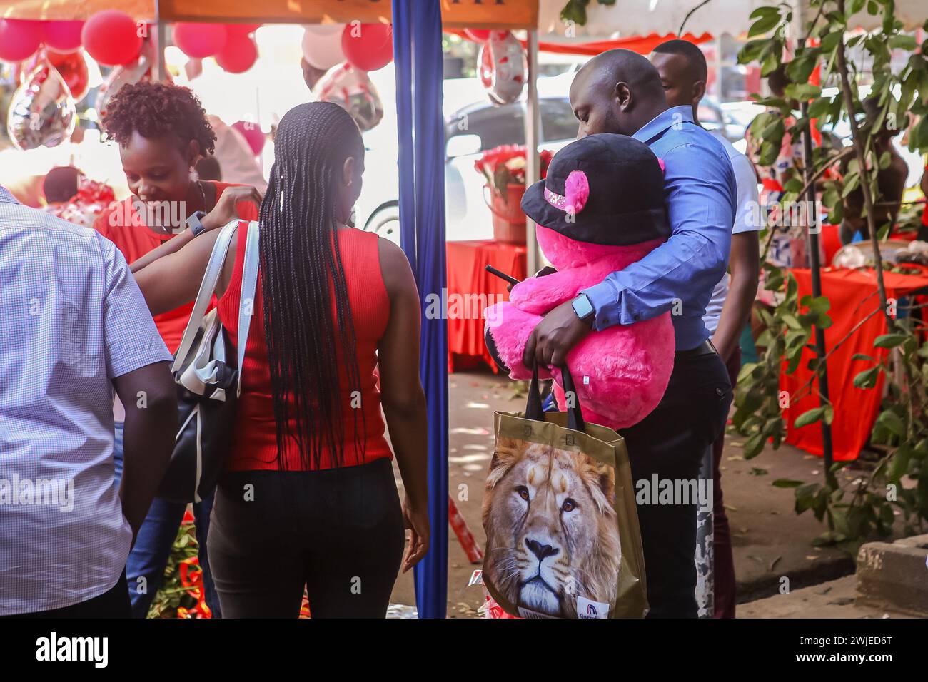 Nairobi, Kenya. 14th Feb, 2024. A Kenyan man holds a teddy bear after ...