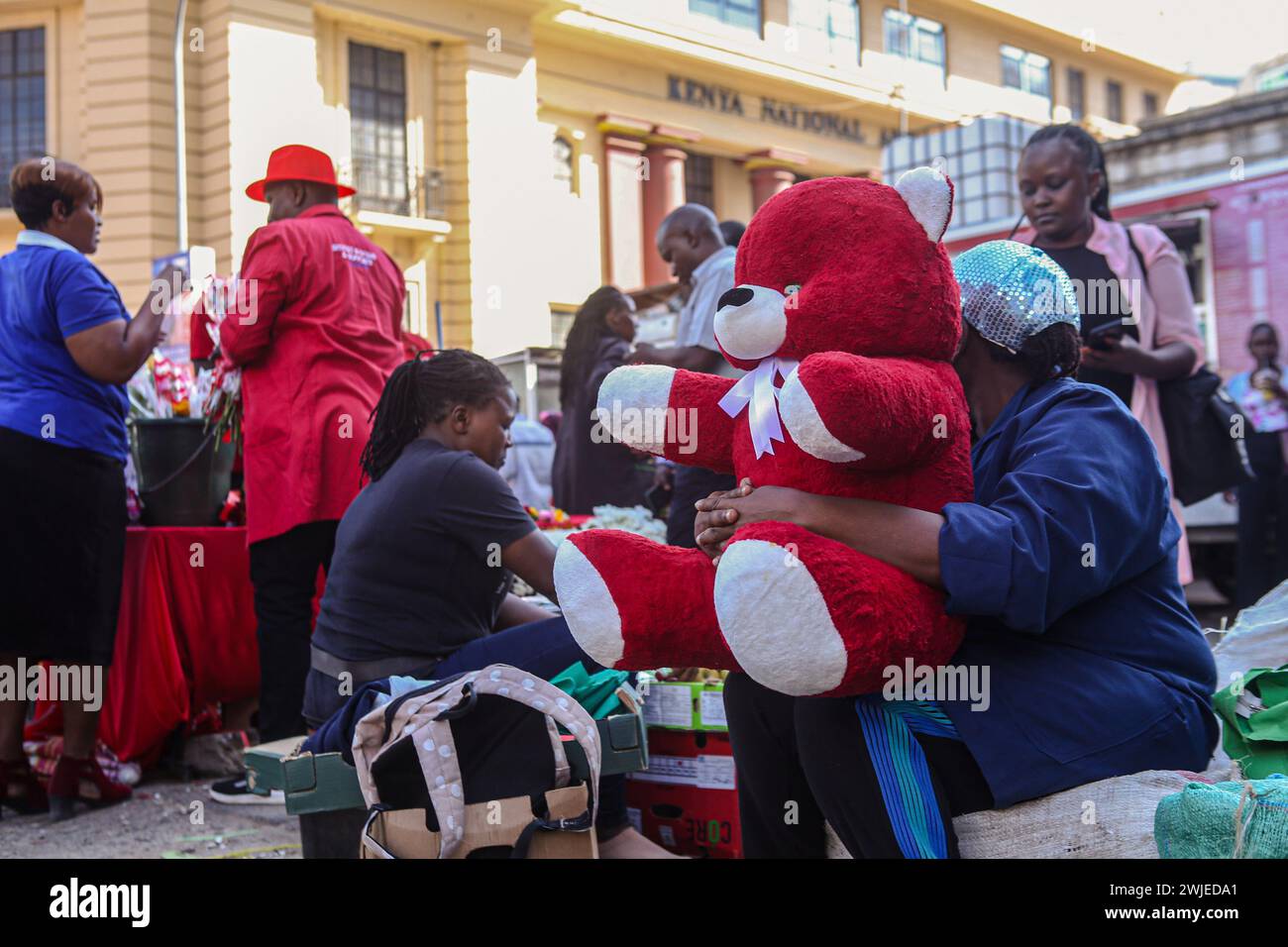 Nairobi, Kenya. 14th Feb, 2024. A Kenyan vendor waits on customers as ...