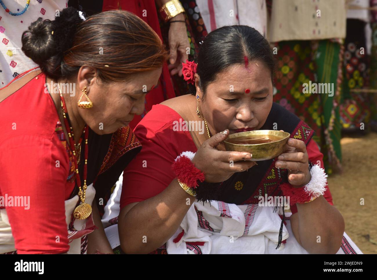 Guwahati, Guwahati, India. 14th Feb, 2024. A Mising tribe woman drink ...