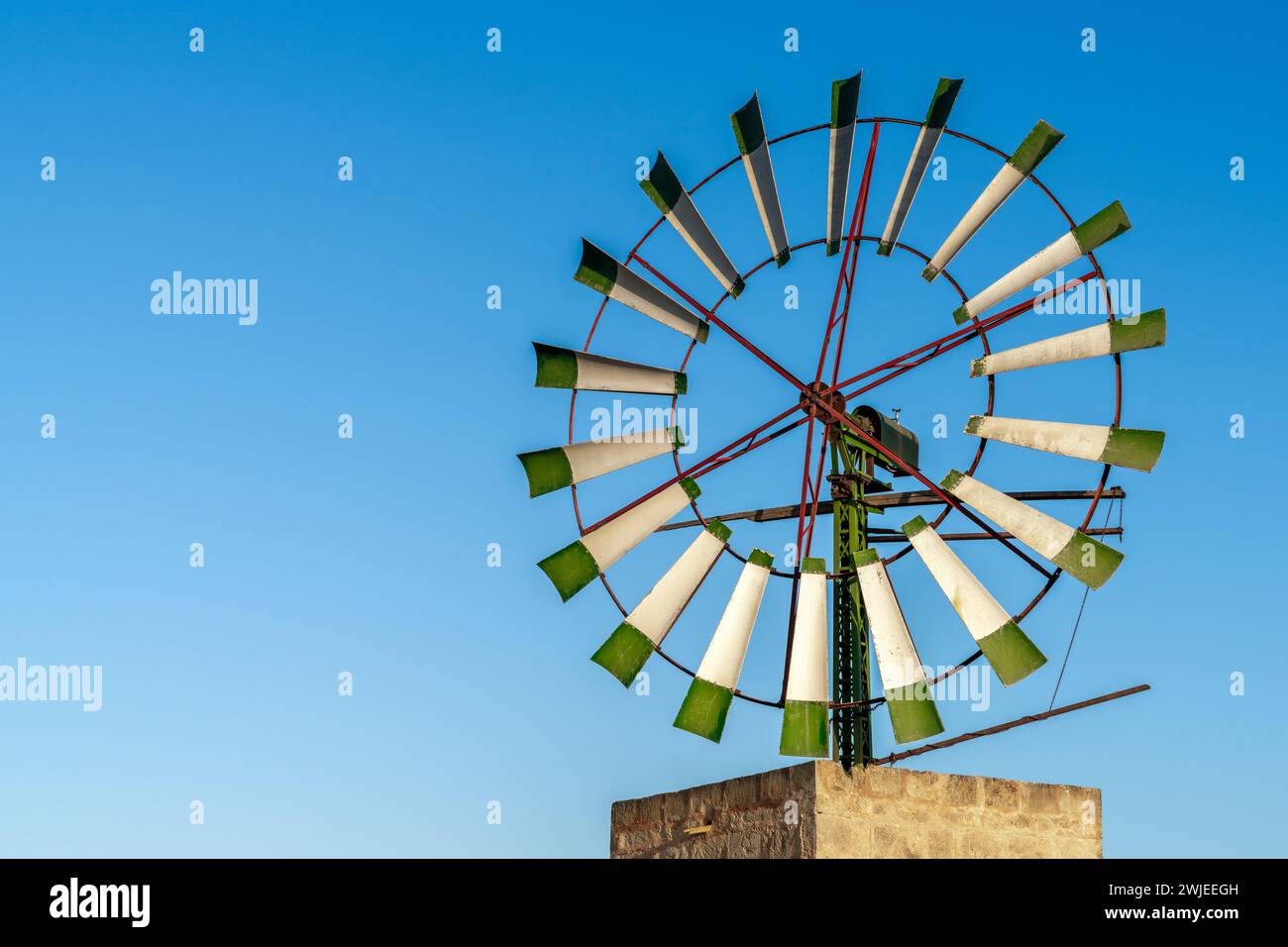 A close-up view of a modern windmill with steel blades in the interior ...