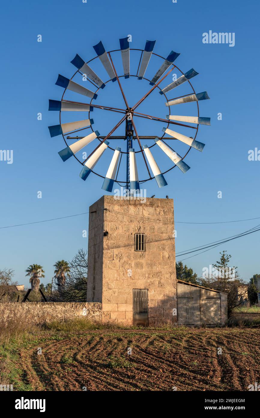 A close-up view of a modern windmill with steel blades in the interior ...